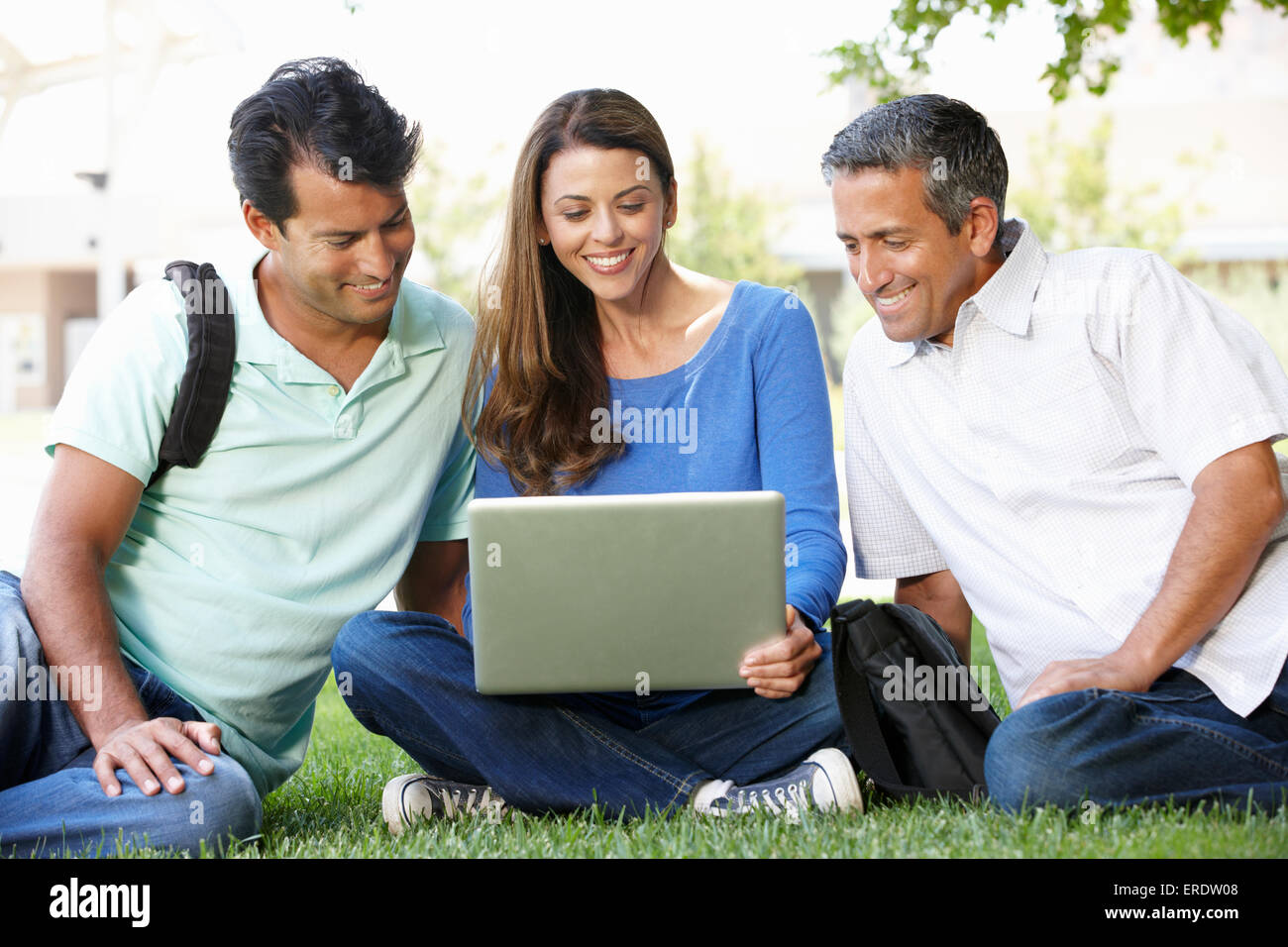 People using laptop outdoors Stock Photo - Alamy