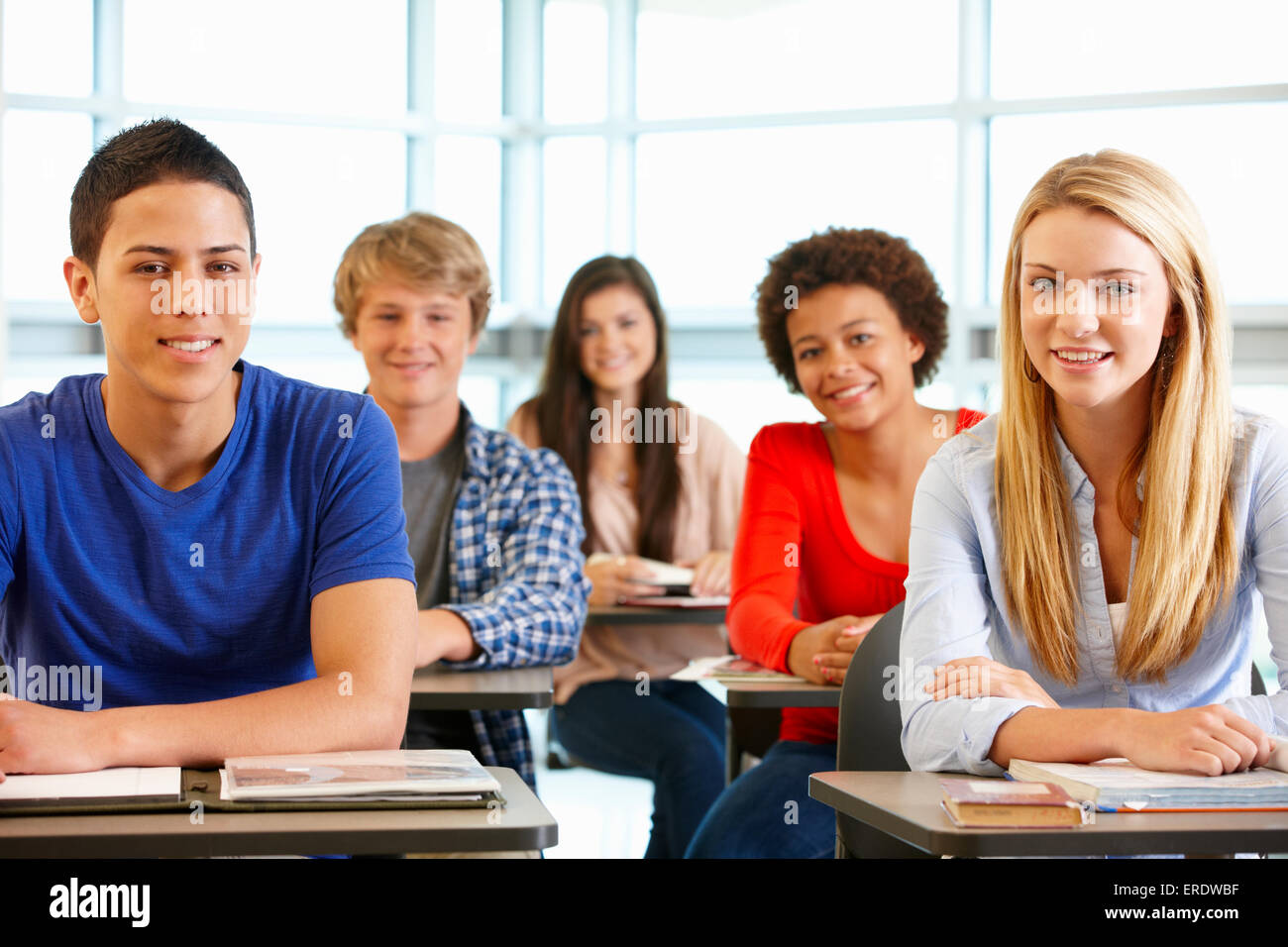 Multi racial teenage pupils in class Stock Photo - Alamy