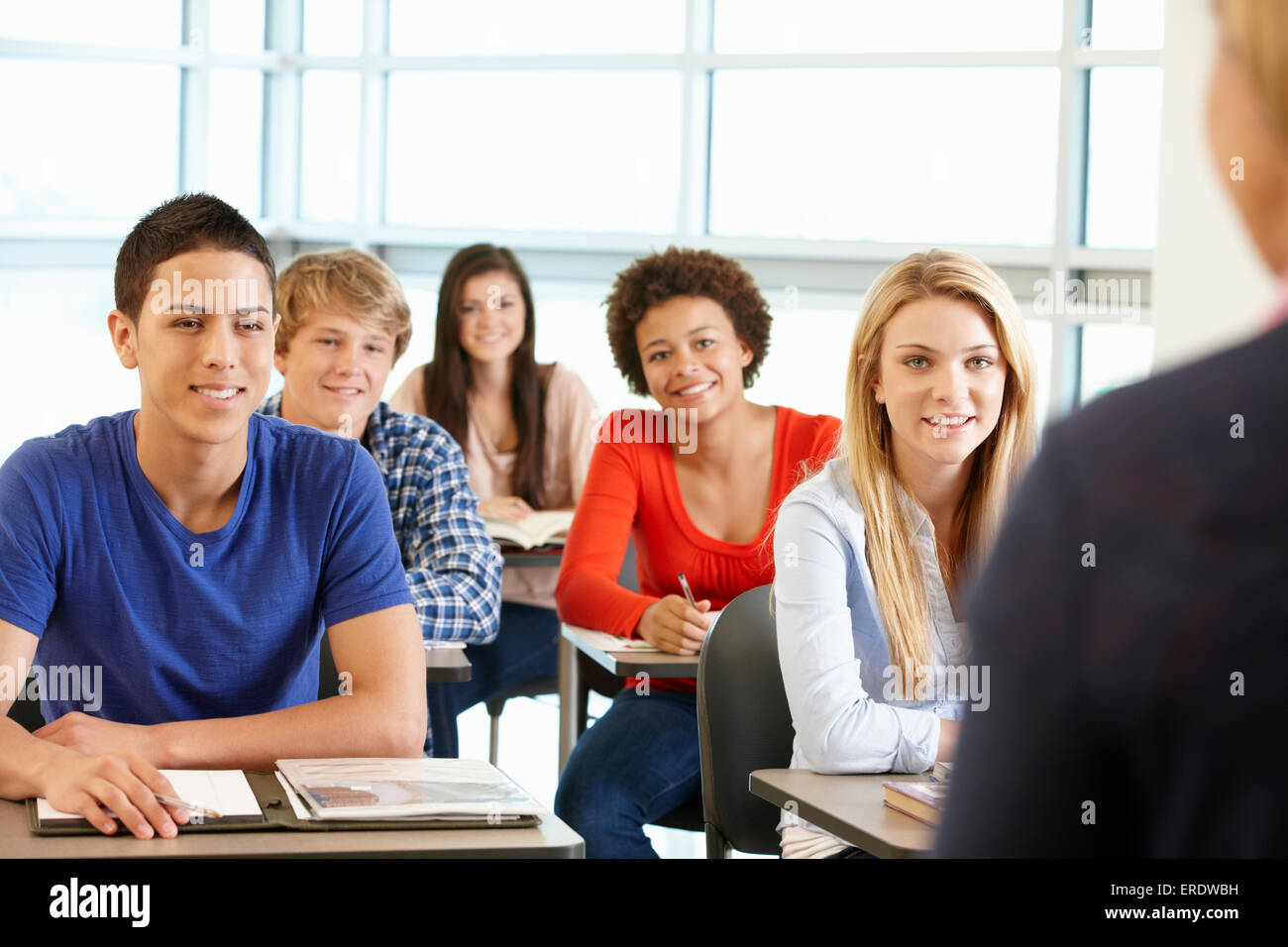Multi racial teenage pupils in class Stock Photo - Alamy