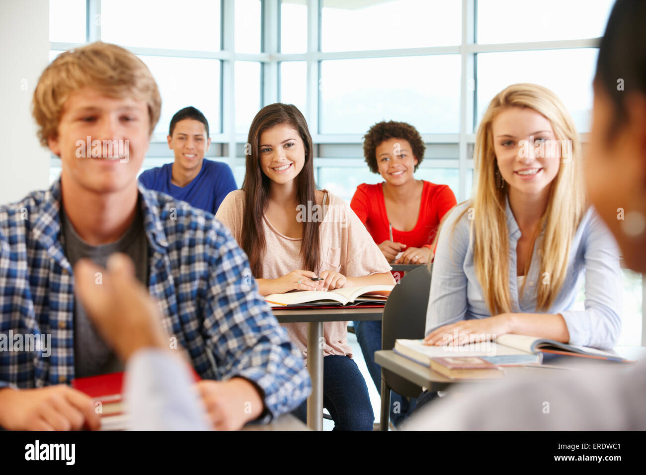 Multi racial teenage pupils in class Stock Photo - Alamy