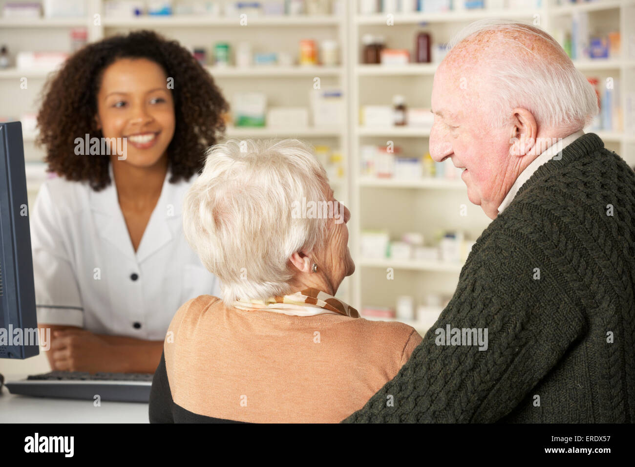 American pharmacist dispensing senior couple hi-res stock photography ...