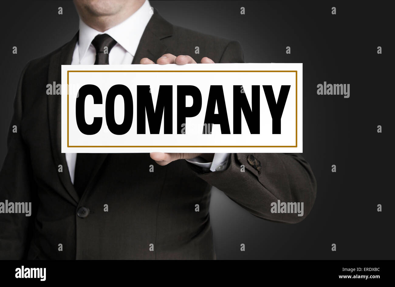 Company sign is held by businessman Stock Photo - Alamy