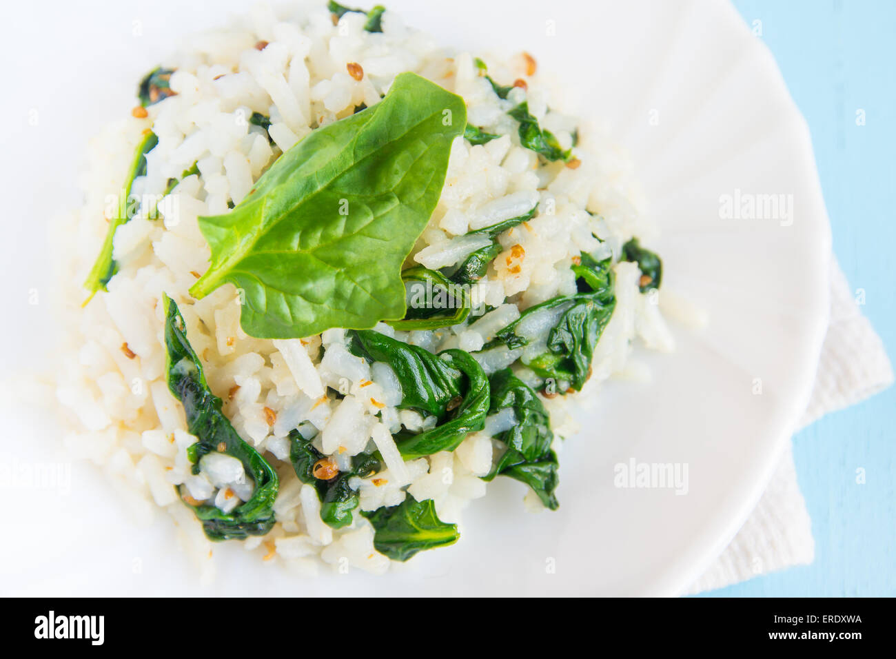 Spinach risotto with white rice on plate, italian vegetarian cuisine ...
