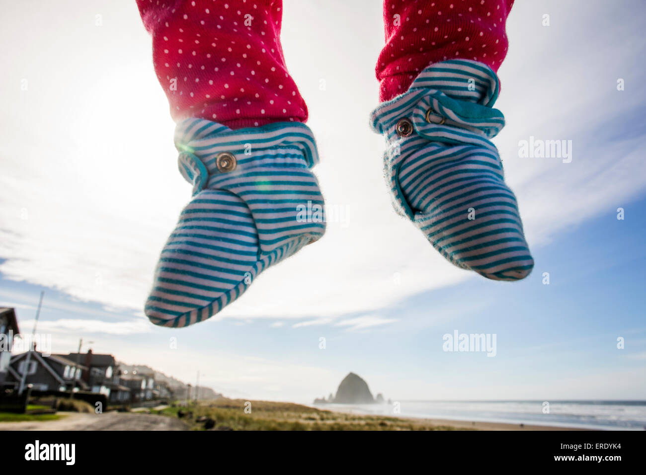 Close up of feet of Caucasian baby hovering over beach Stock Photo - Alamy