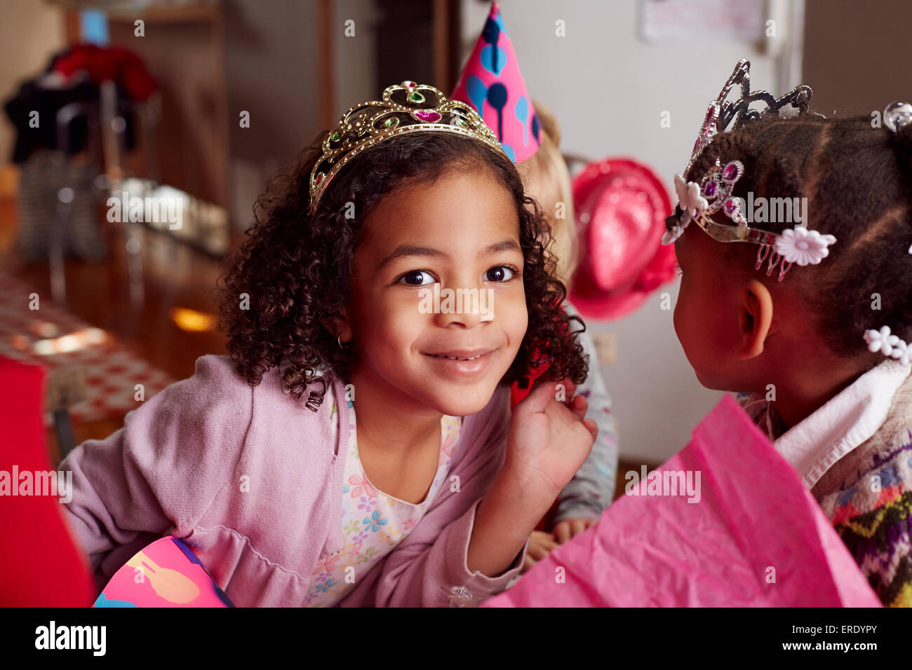 Girls wearing tiaras at party Stock Photo - Alamy