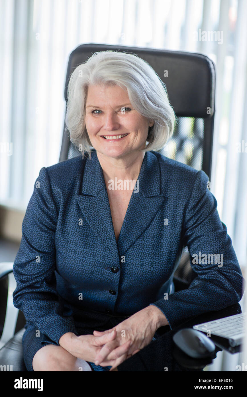 Crossed legs desk hi-res stock photography and images - Alamy