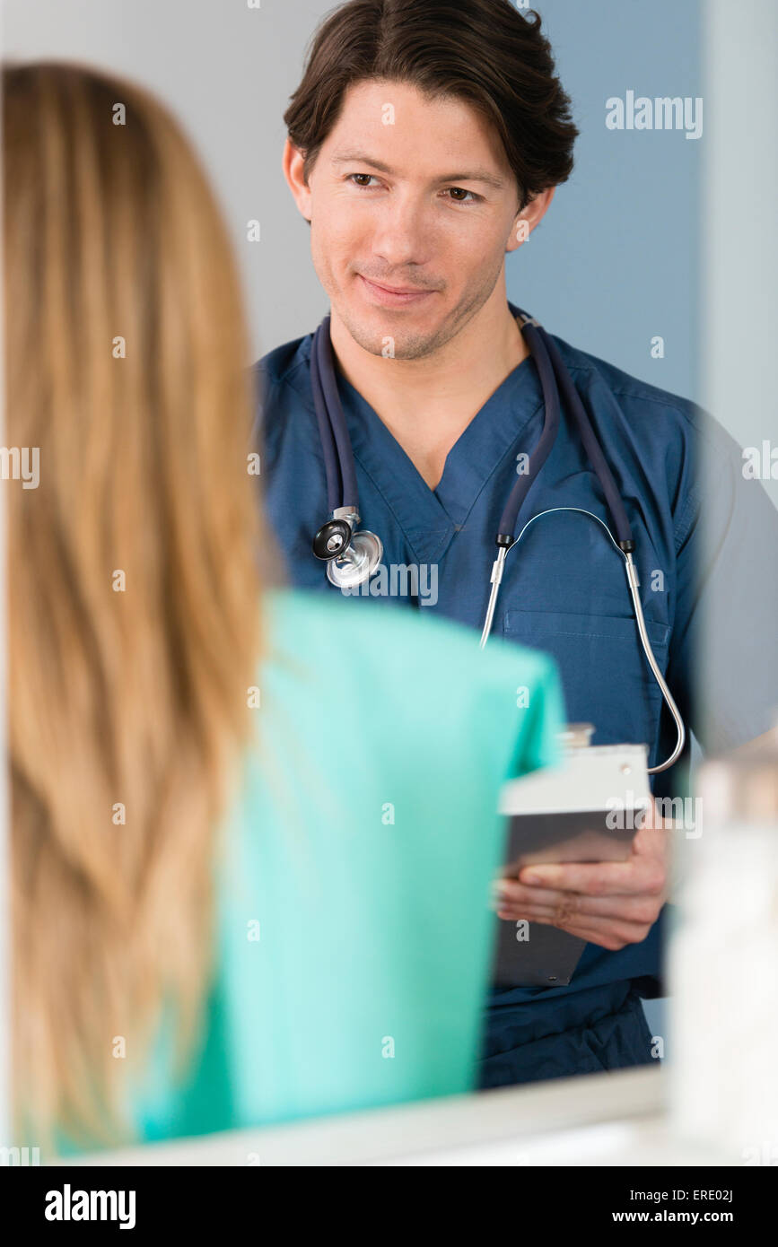 Doctor listening to patient Stock Photo - Alamy