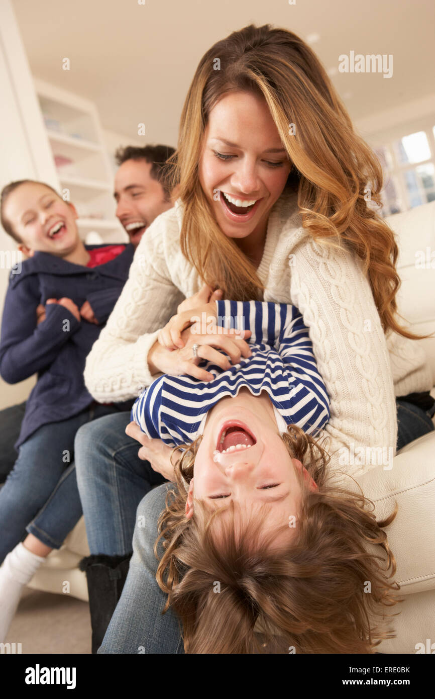 Parents playing with children at home Stock Photo - Alamy