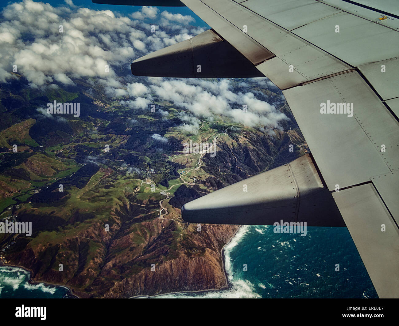 Aerial view of airplane wing flying over coastline Stock Photo - Alamy