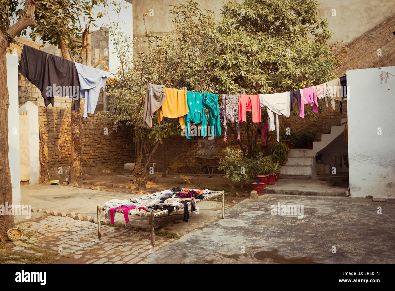 Laundry drying on clothesline in backyard Stock Photo - Alamy
