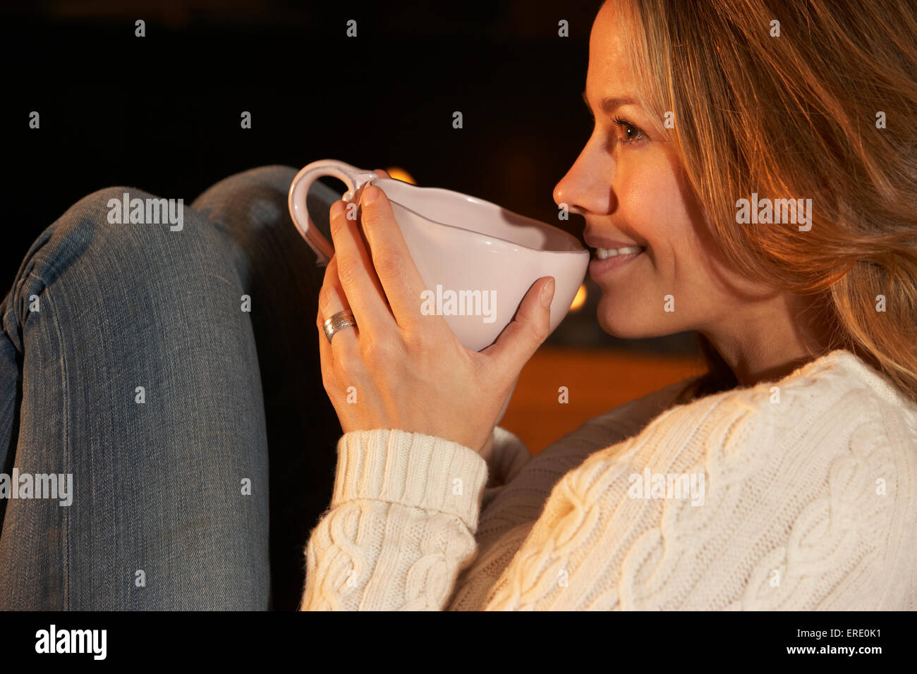 Portrait red haired woman by firelight Stock Photo - Alamy