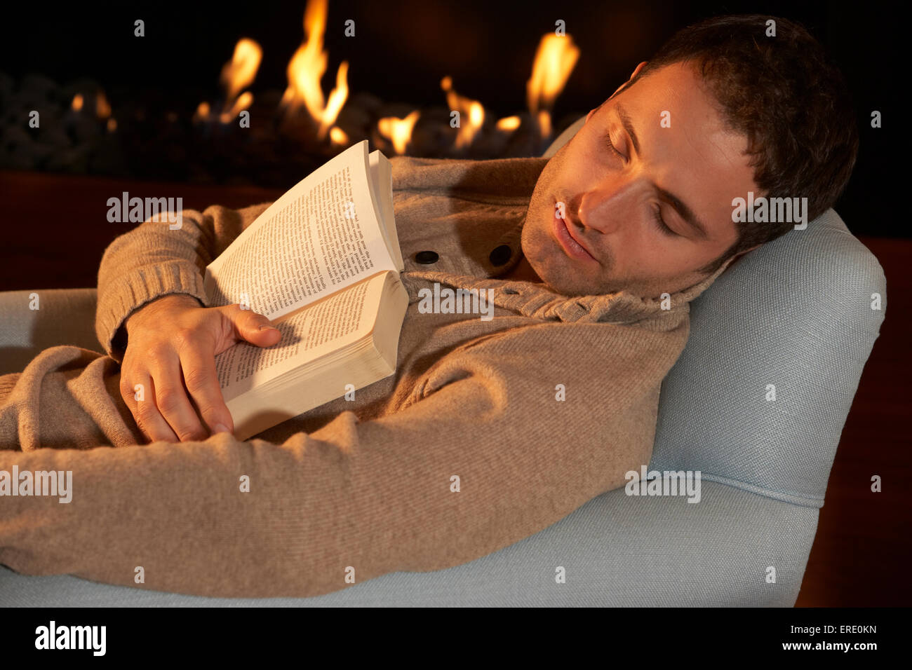 A]sleep in front of fire hi-res stock photography and images - Alamy