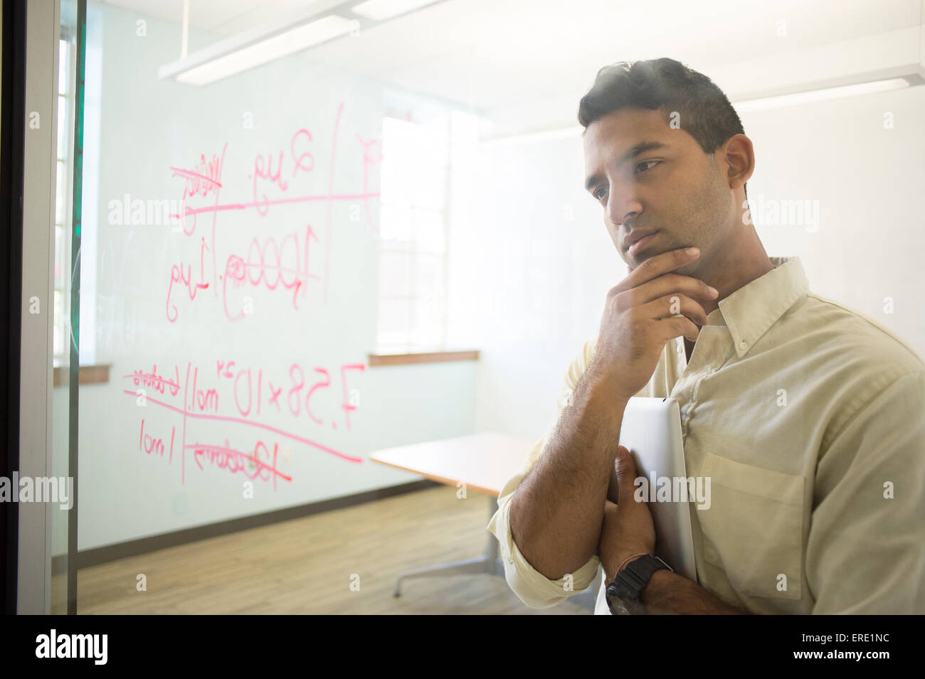 Businessman standing behind glass hi-res stock photography and images ...