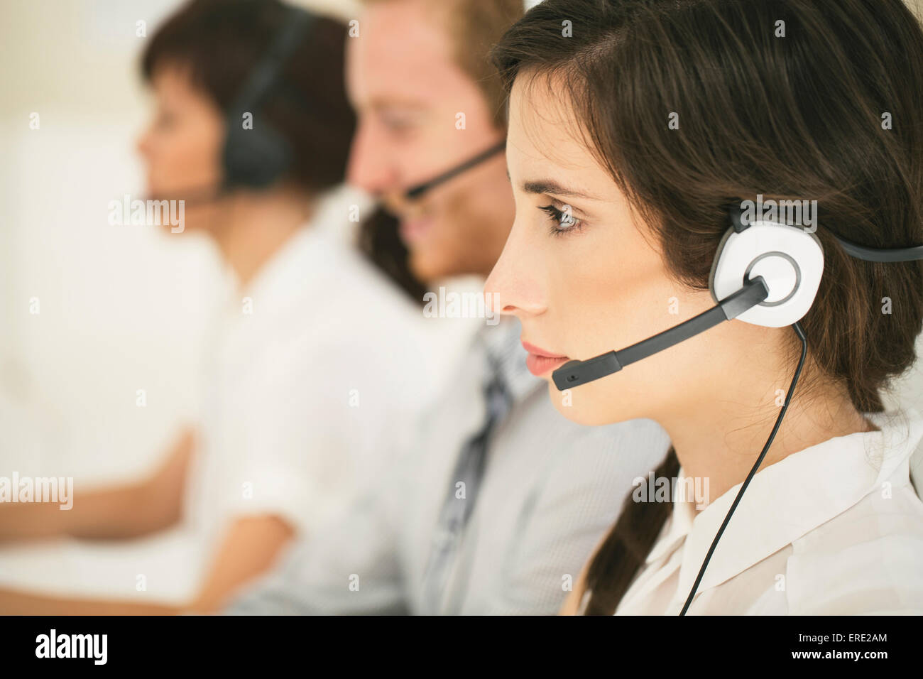 Three people headsets hi-res stock photography and images - Alamy