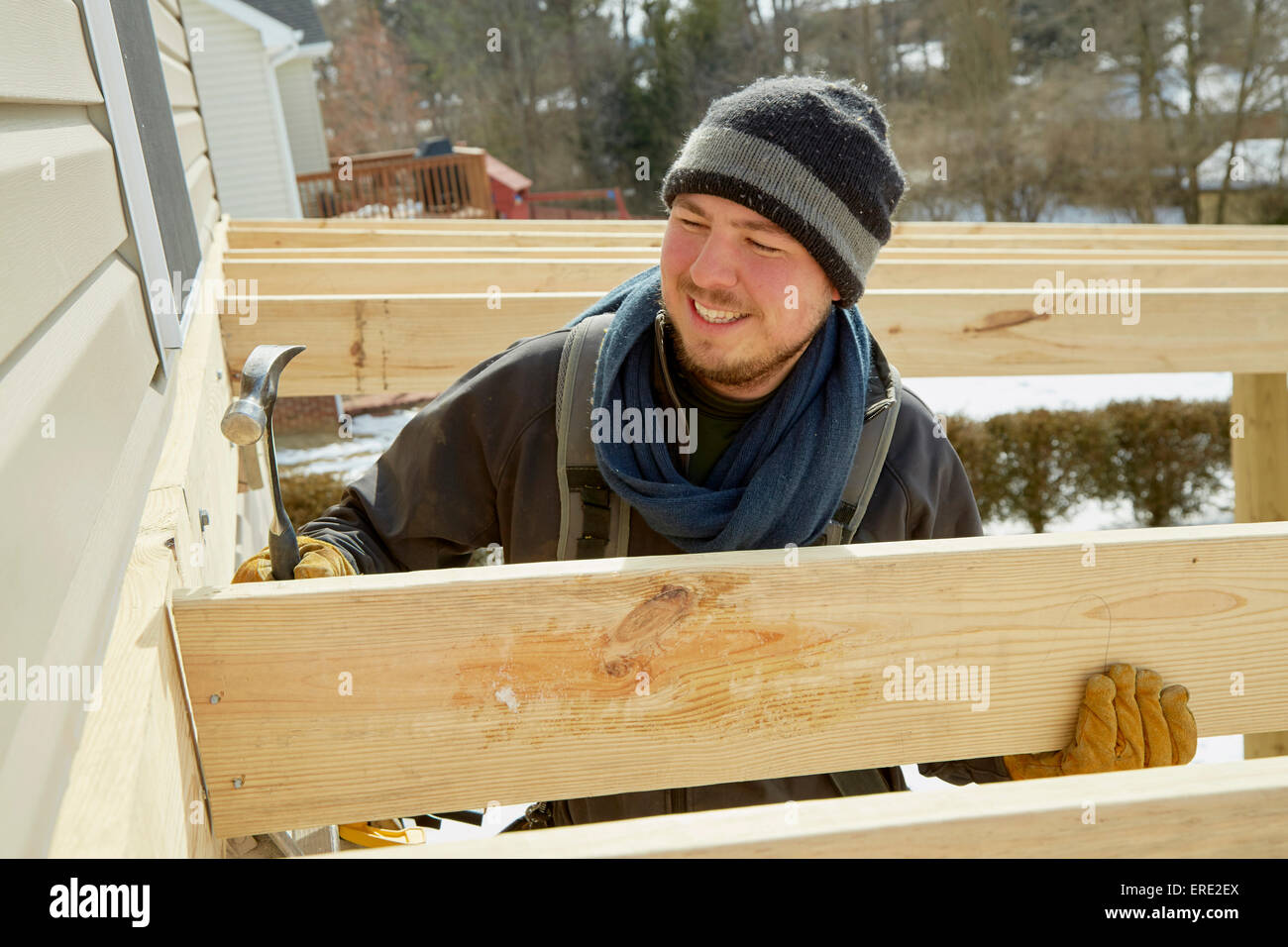 Caucasian carpenter building house extension in winter Stock Photo - Alamy