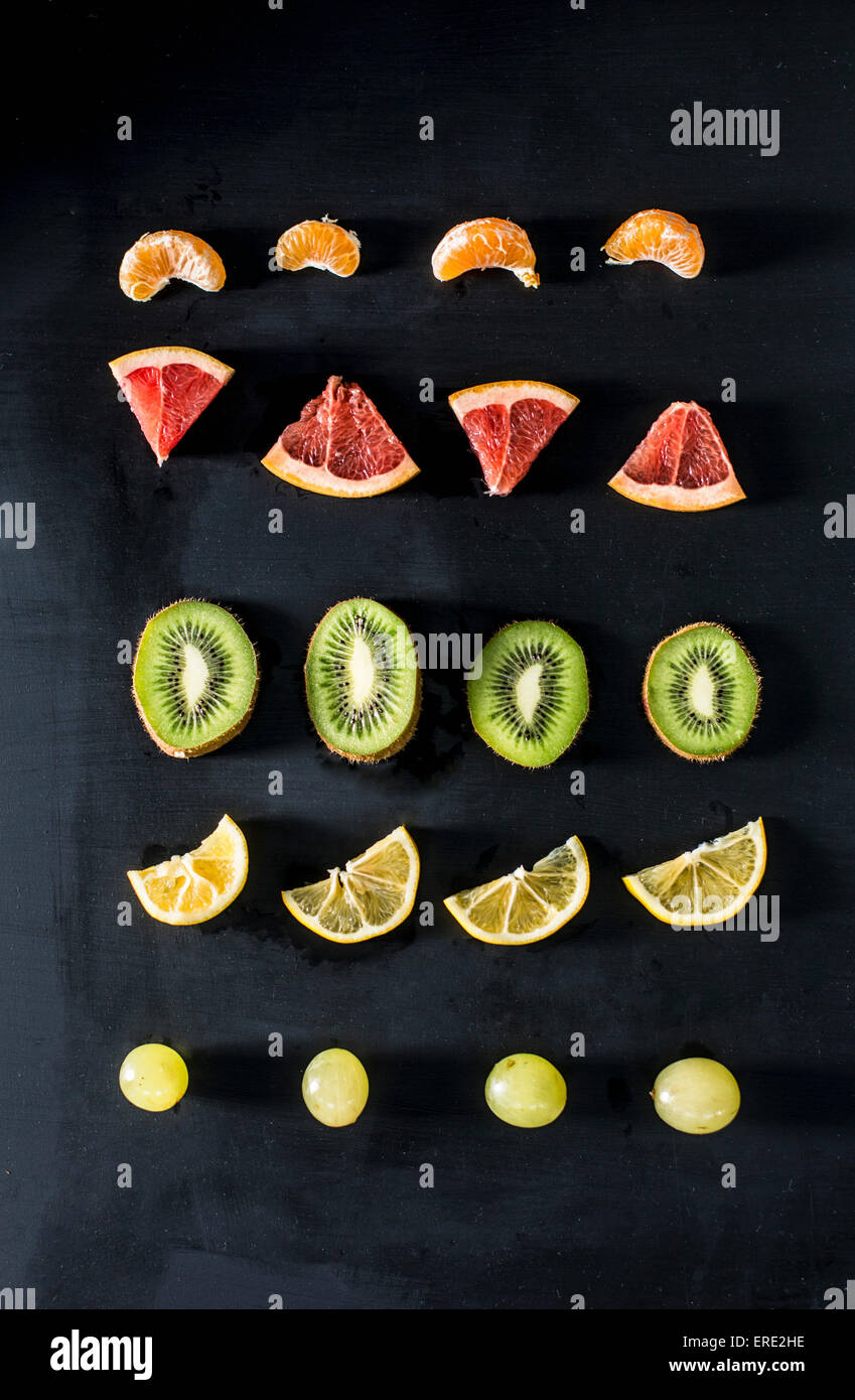 Fruit slices arranged in rows Stock Photo - Alamy