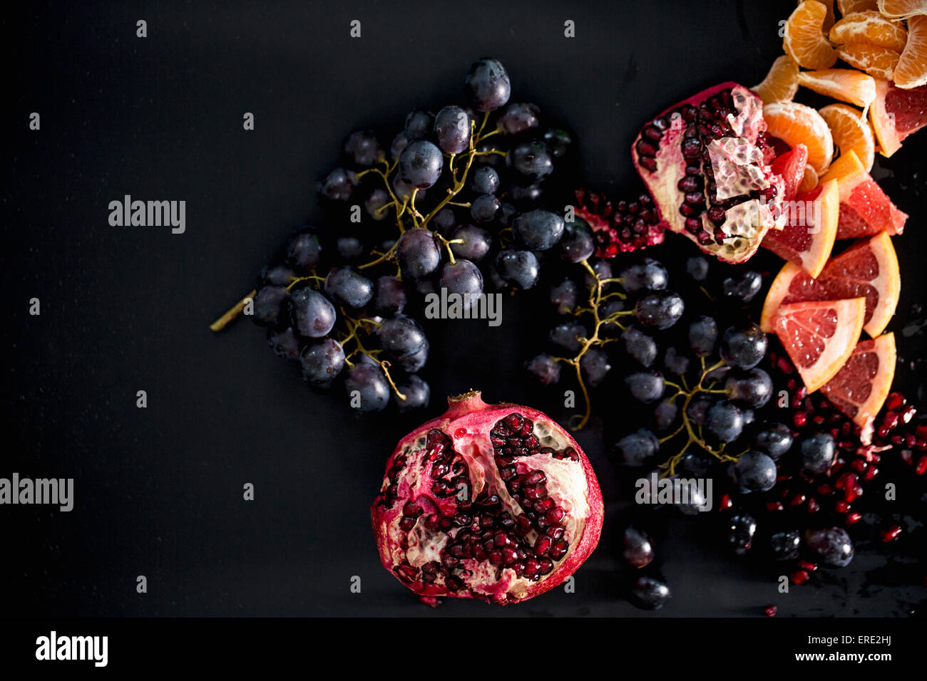 Close up of pomegranates and grapes Stock Photo - Alamy