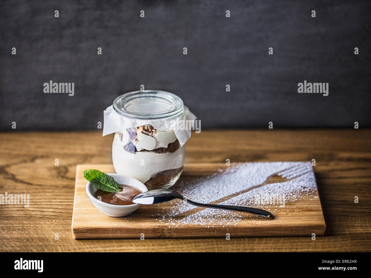 Chocolate parfait dessert with spoon and powdered sugar fork outline ...