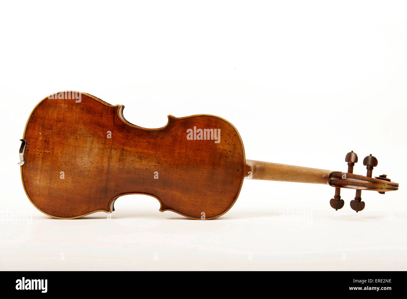 Violin, showing the one piece back, neck and scroll. German made ...
