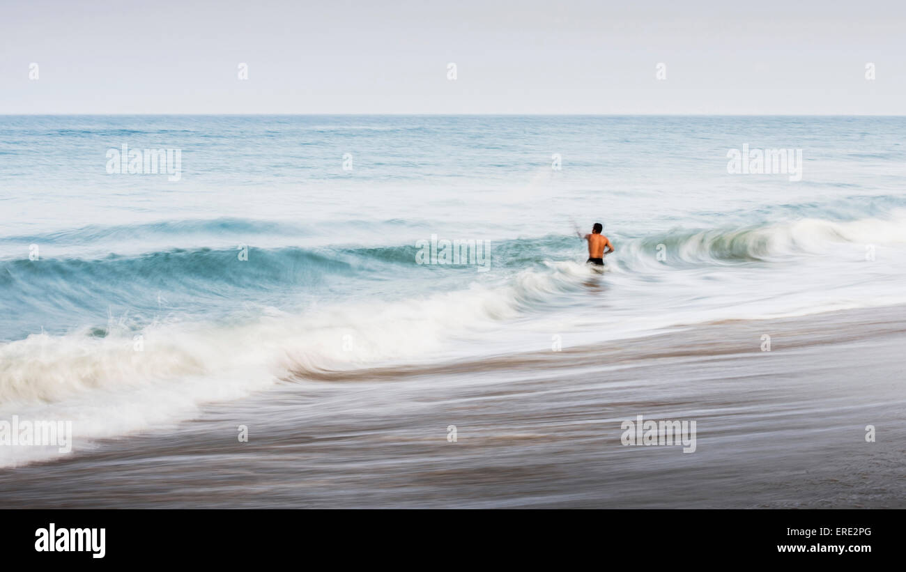 Man swimming in waves Stock Photo - Alamy