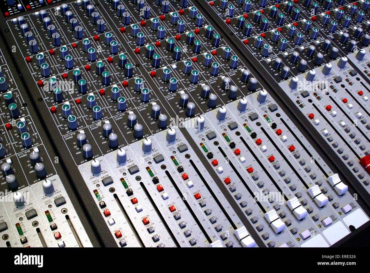 Close-up of faders and knobs on mixing desk Stock Photo - Alamy