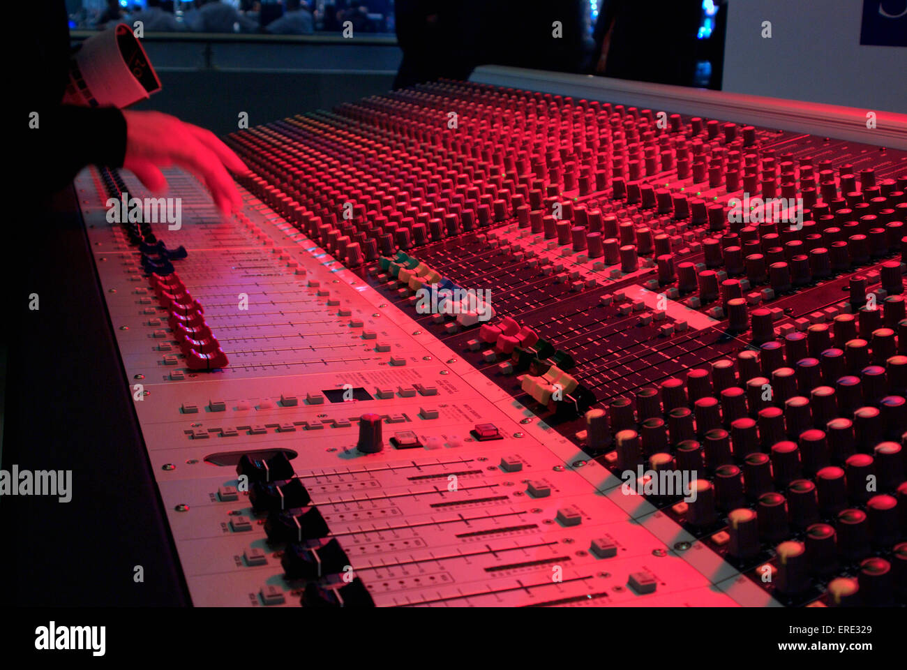Mixing desk with hand Stock Photo - Alamy