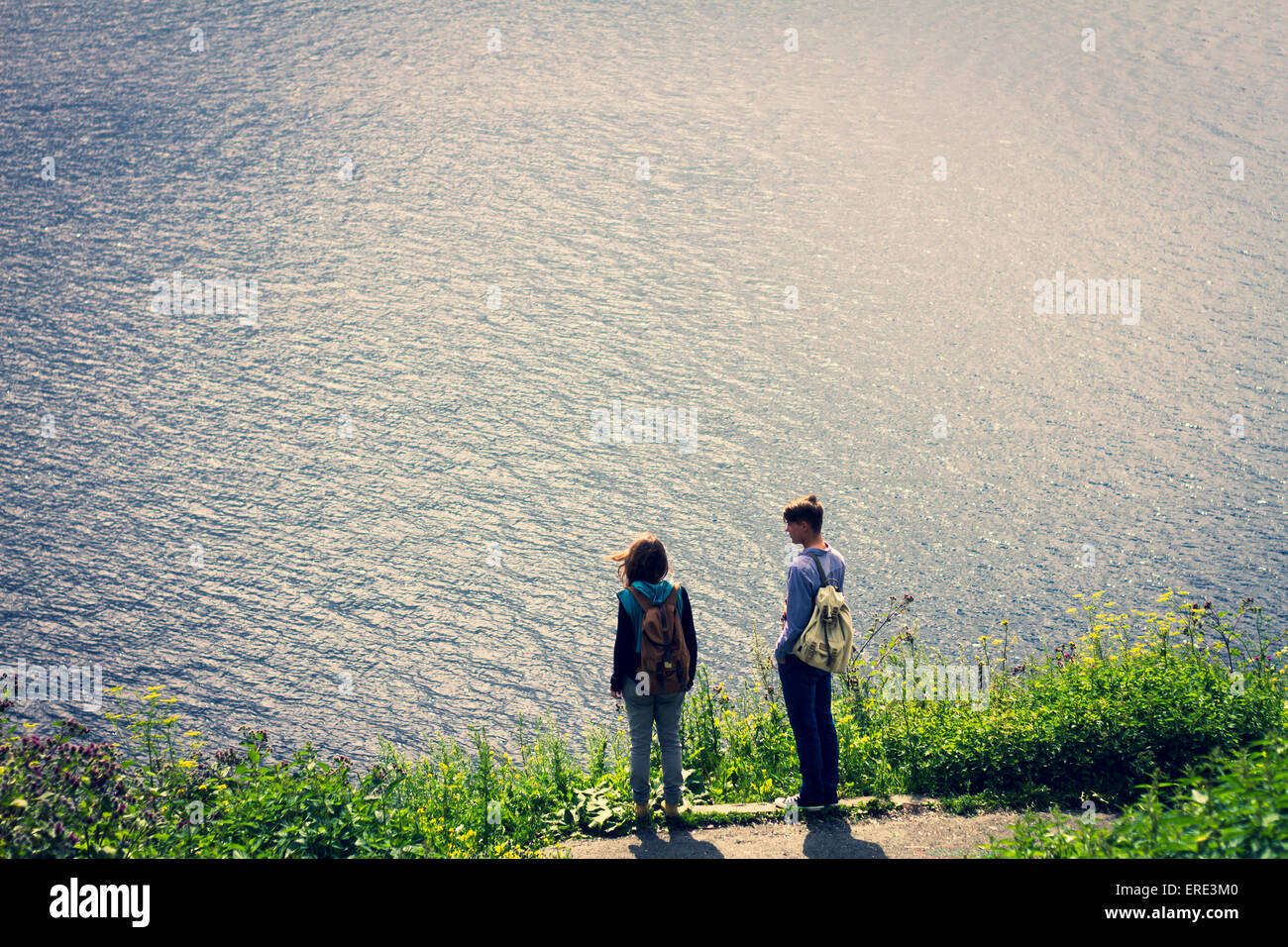 High angle view of Caucasian couple standing near lake Stock Photo - Alamy