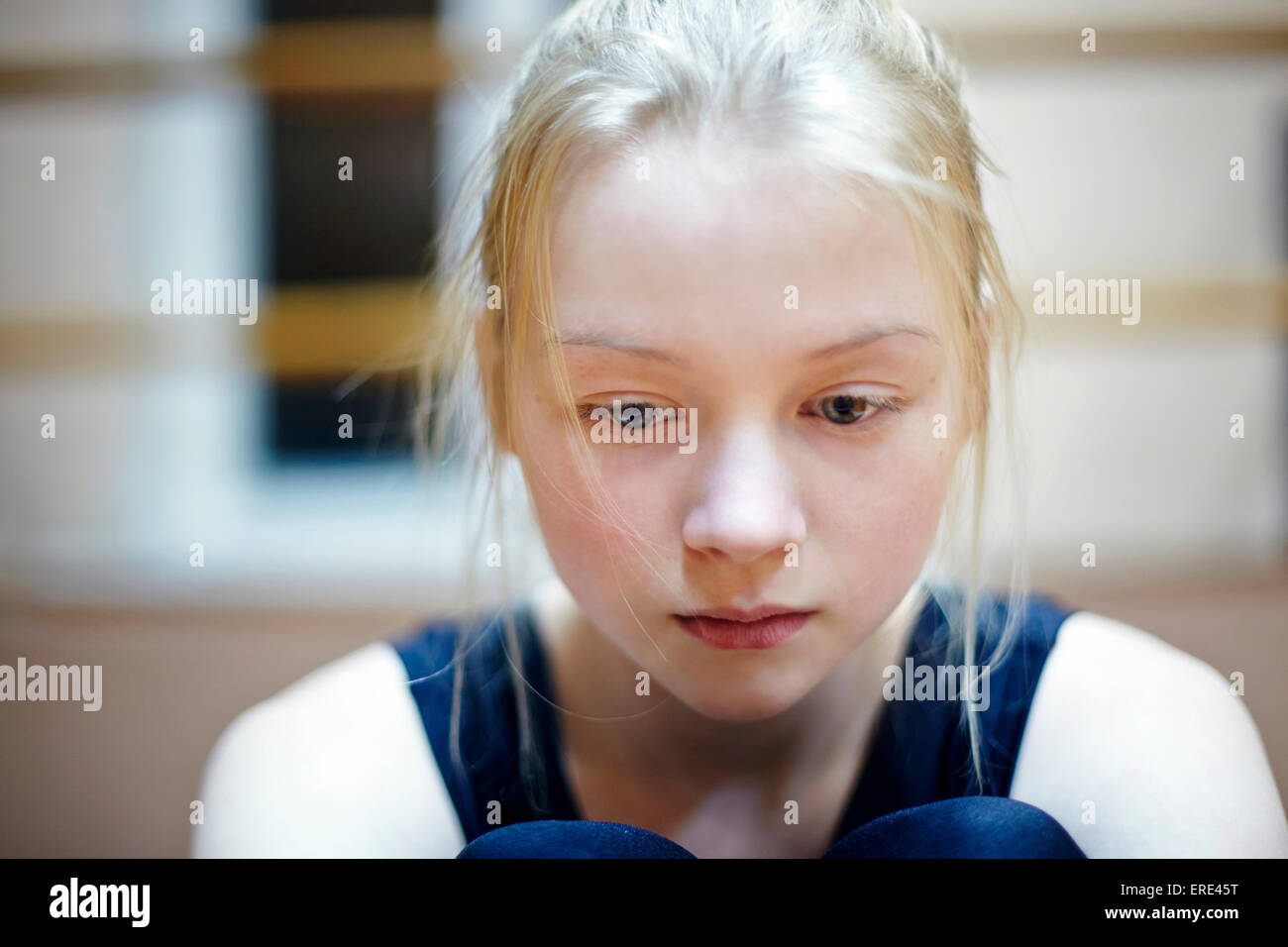 Caucasian girl looking down Stock Photo - Alamy
