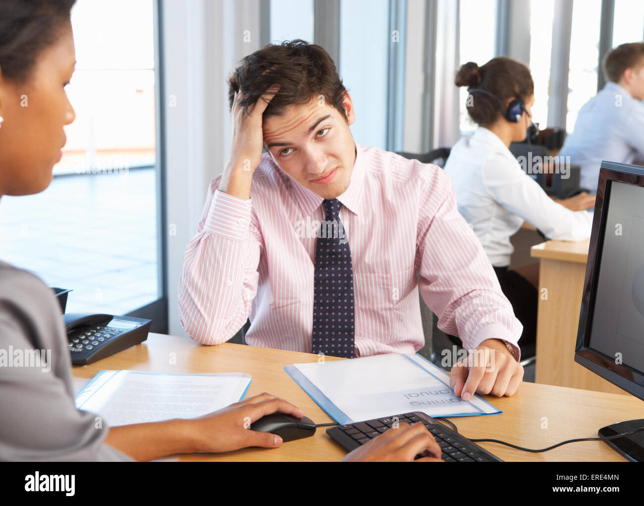 Stressed Employee Working In Busy Office Stock Photo - Alamy