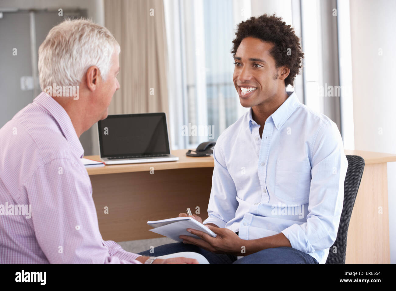 Middle aged african man talking hi-res stock photography and images - Alamy