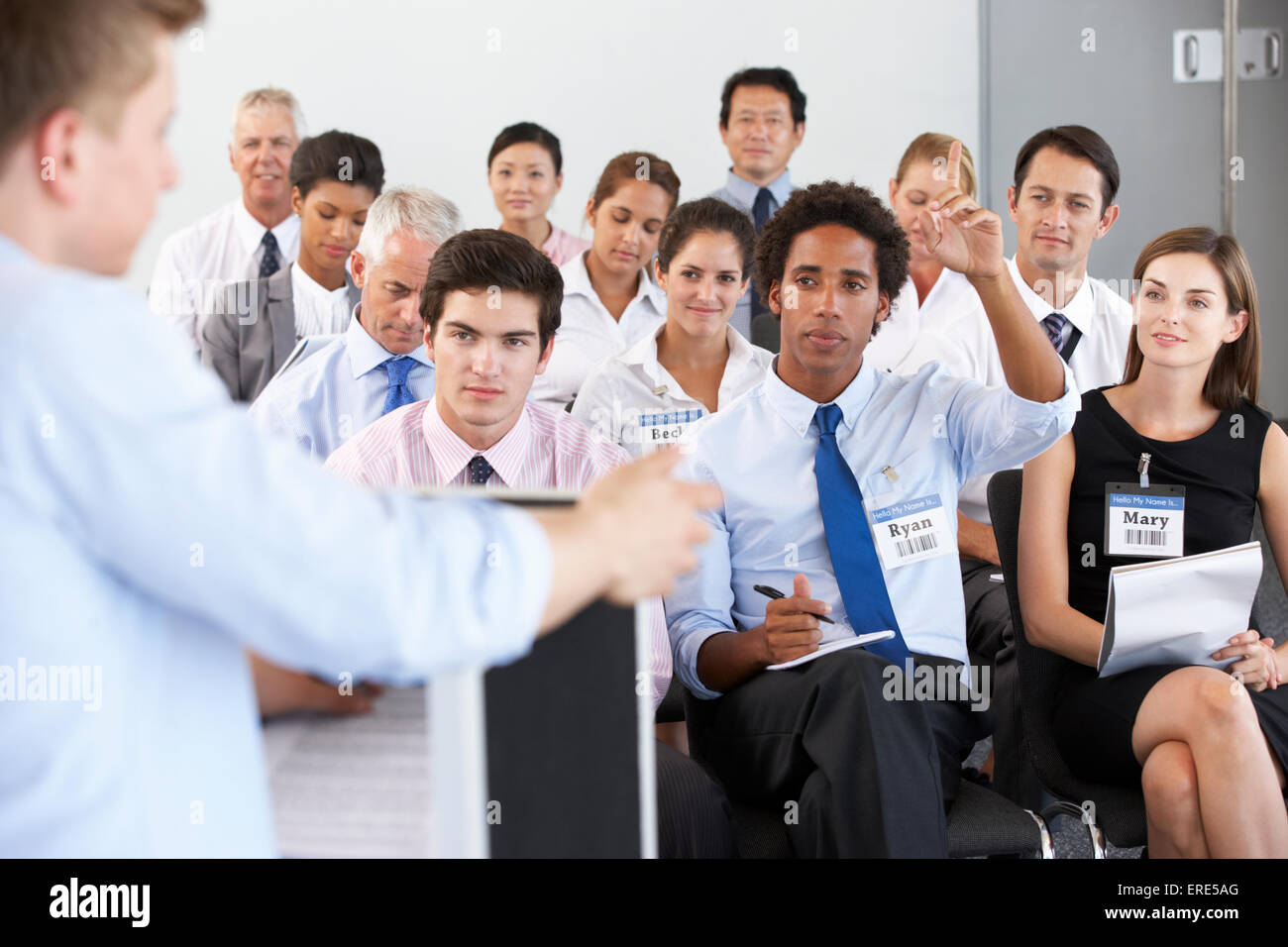 Businessman Delivering Presentation At Conference Stock Photo - Alamy