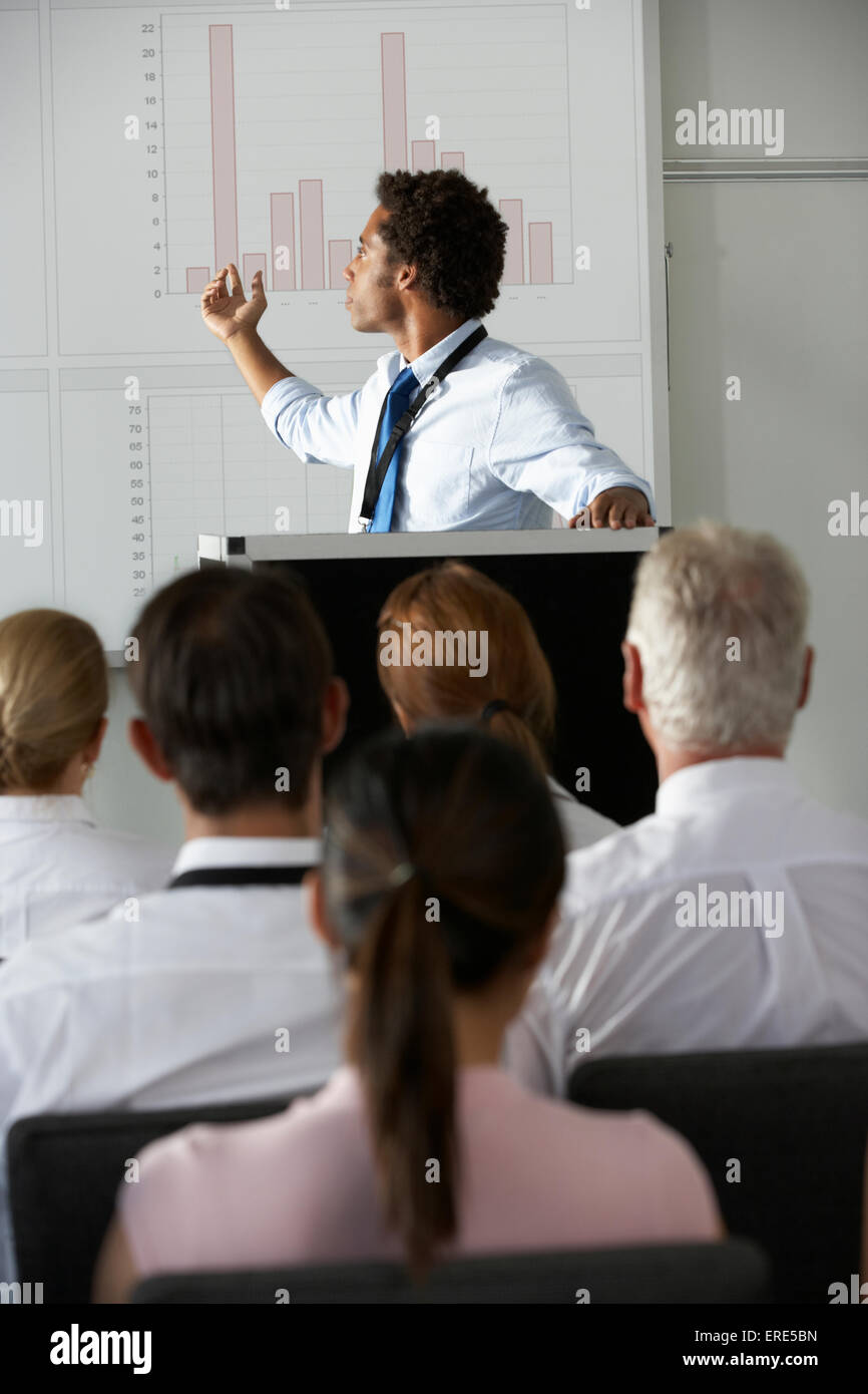 Young Businessman Delivering Presentation At Conference Stock Photo - Alamy