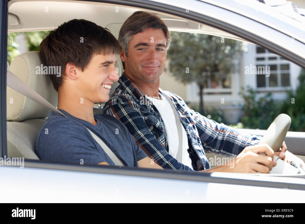Father teaching son to drive car hi-res stock photography and images ...