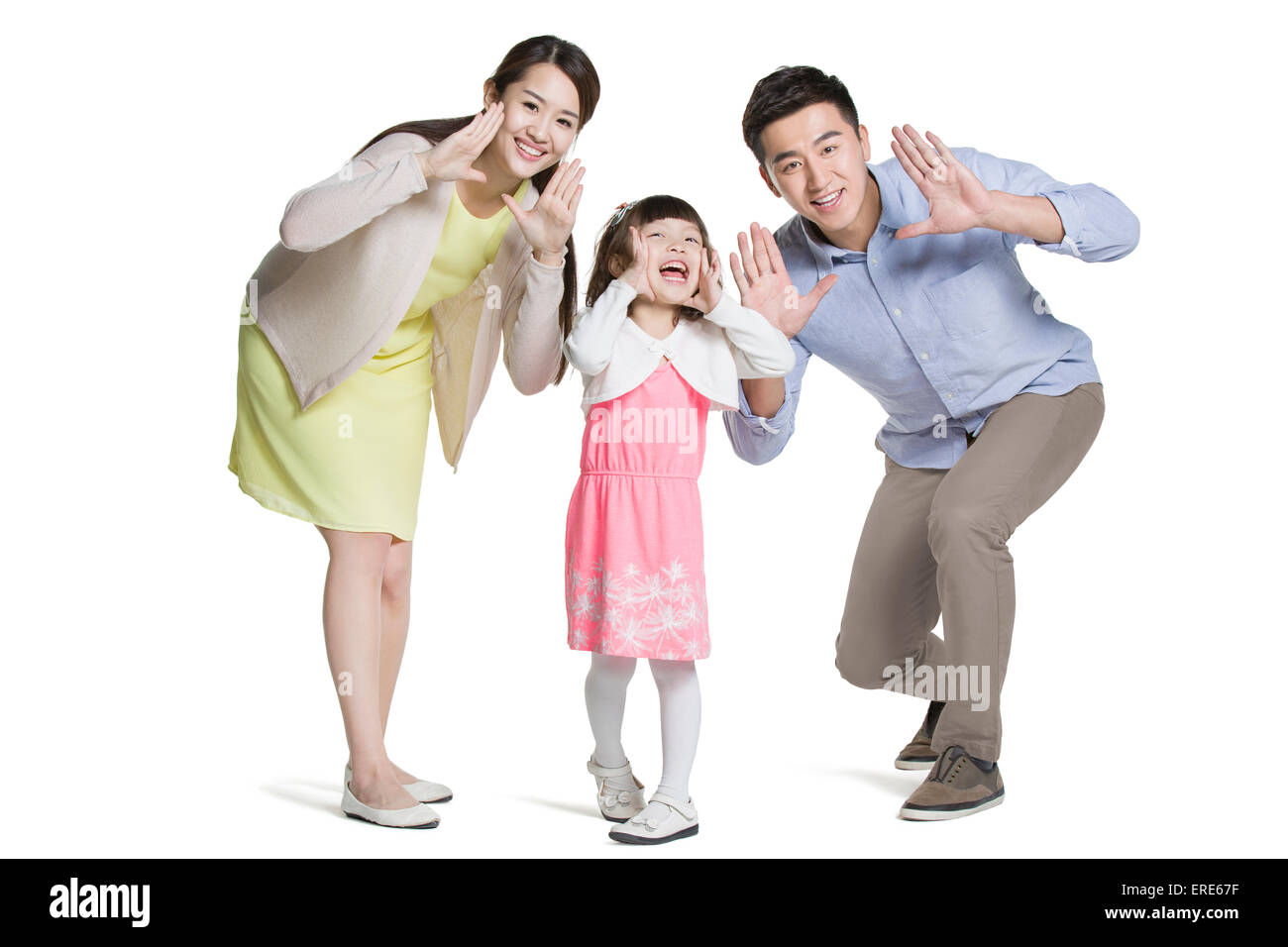 Happy young family shouting together Stock Photo - Alamy