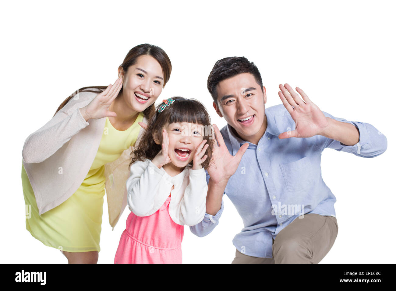 Happy young family shouting together Stock Photo - Alamy