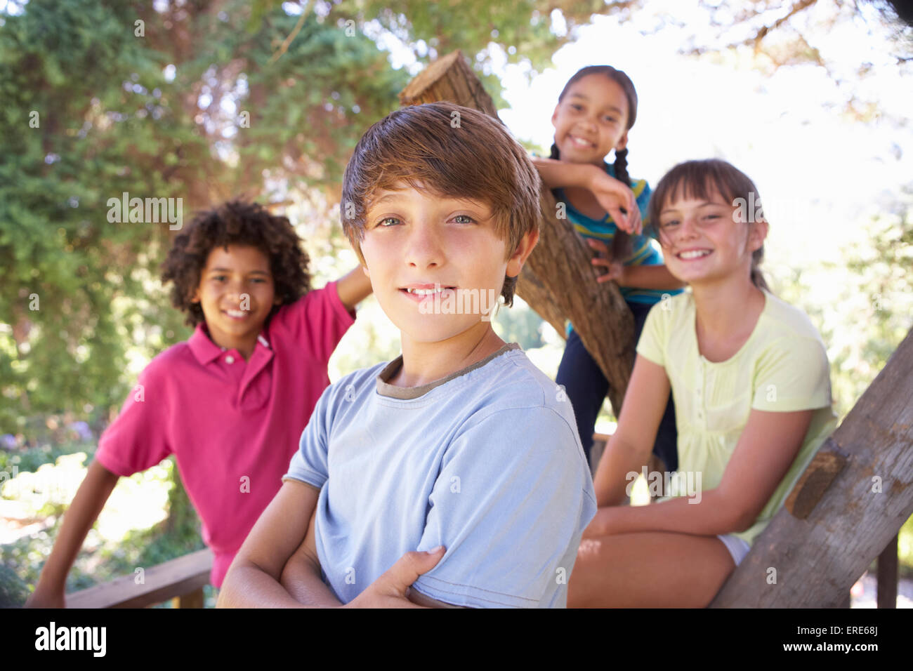 Group Of Children Hanging Out In Treehouse Together Stock Photo - Alamy