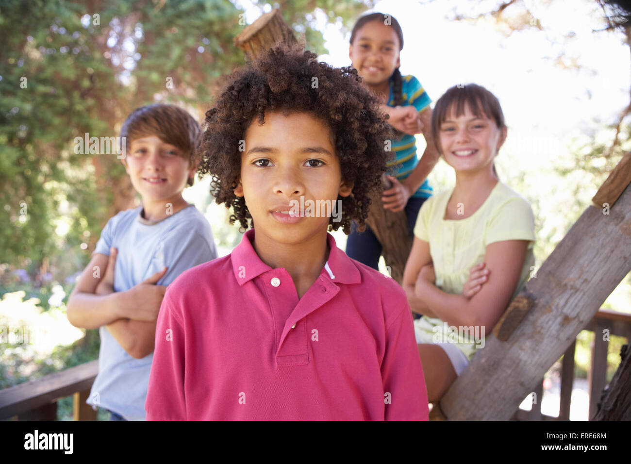 Group Of Children Hanging Out In Treehouse Together Stock Photo - Alamy