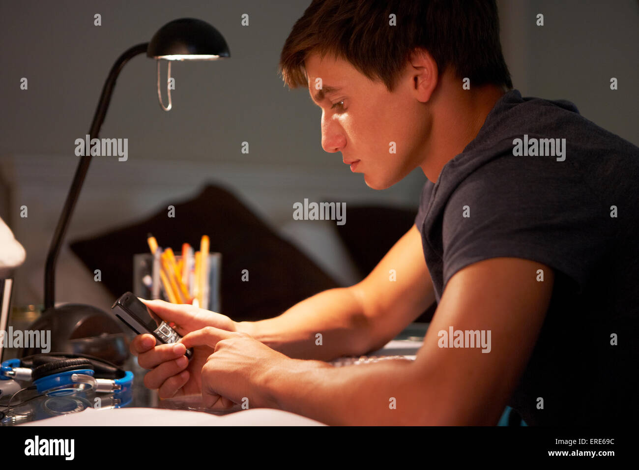 Teenager revising in bedroom hi-res stock photography and images - Alamy