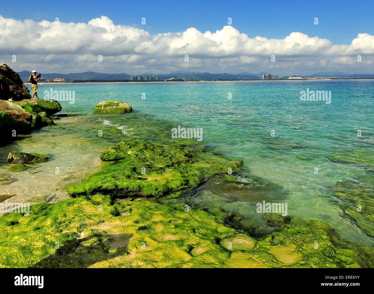 Beijing, China's Hainan Province. 1st Dec, 2012. A tourist takes photos ...
