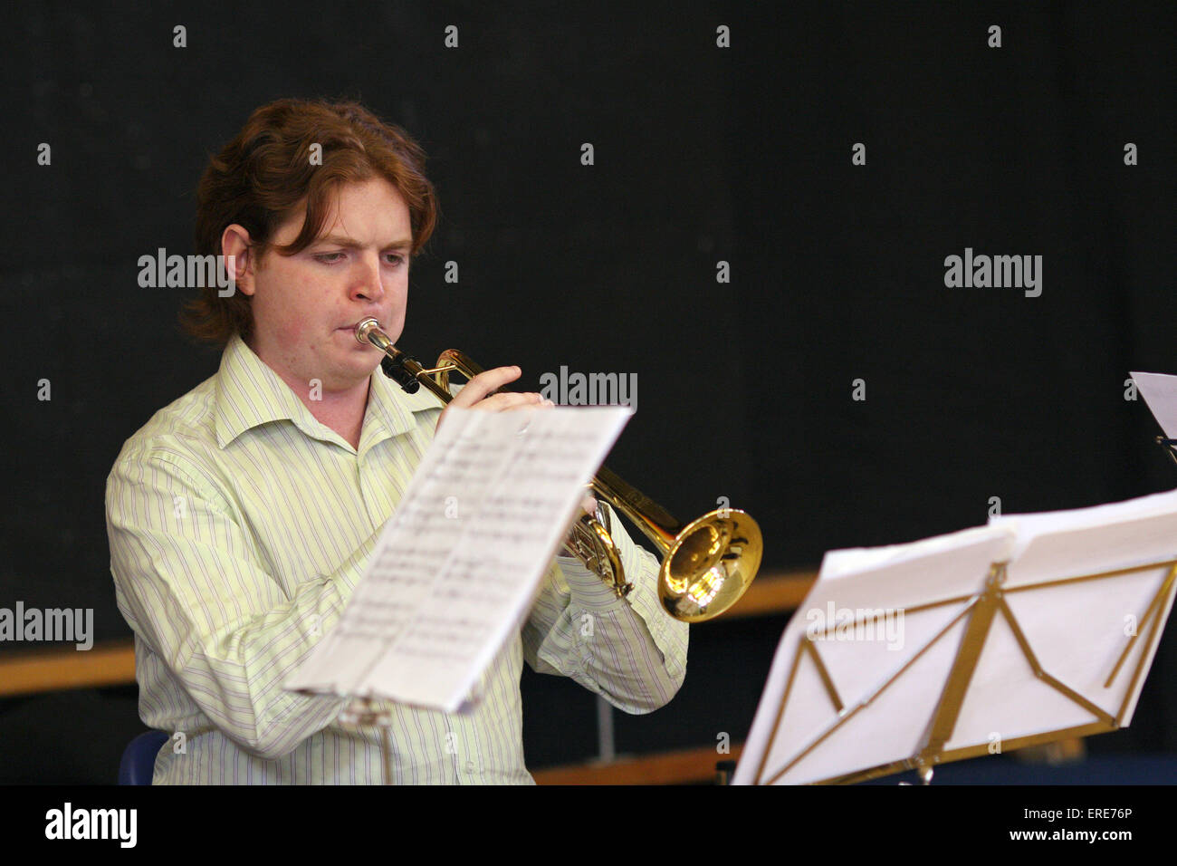 Trumpet player demonstrating and teaching in a school Stock Photo - Alamy