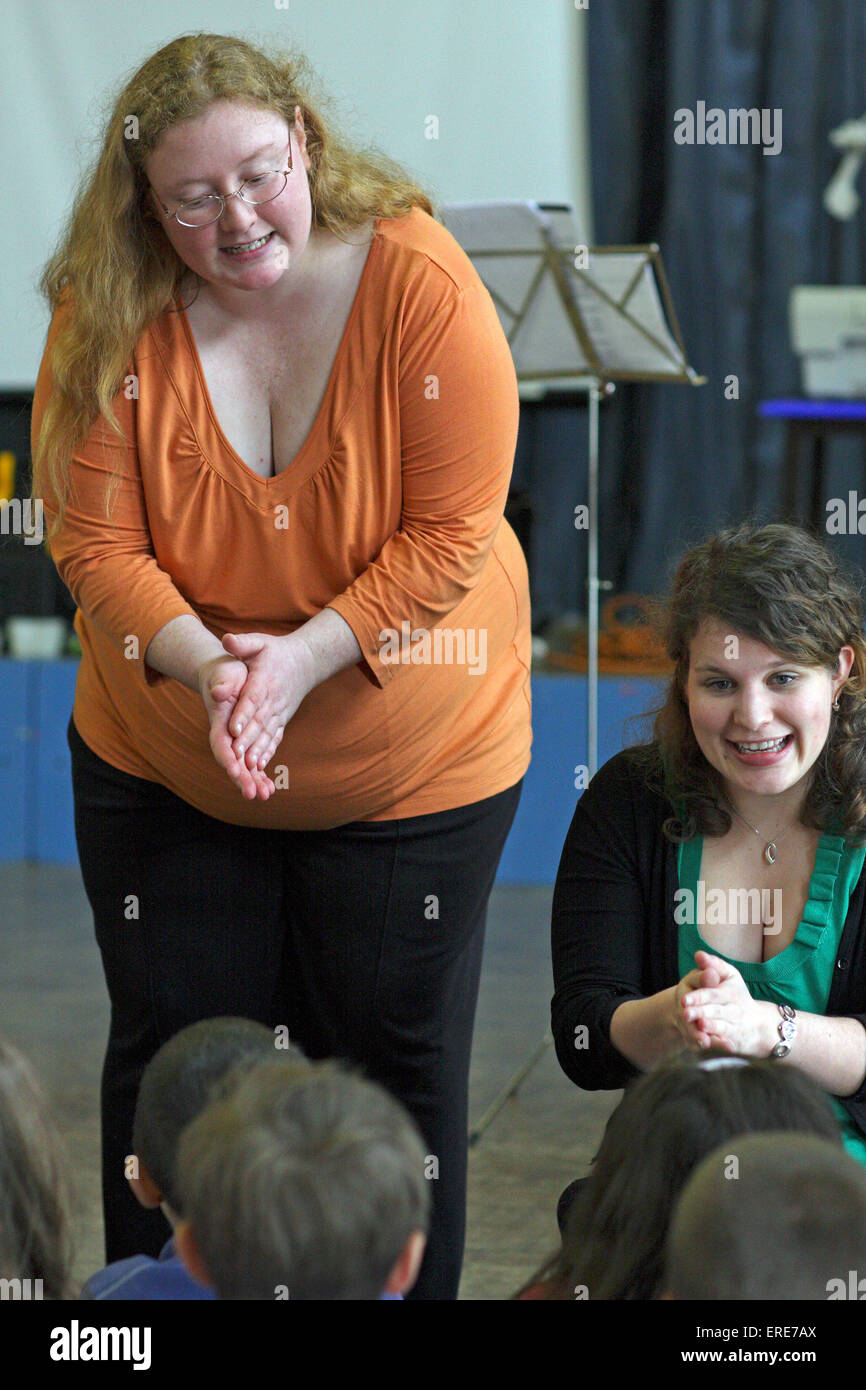 Music workshop in a school, workshop leaders playing a clapping game ...