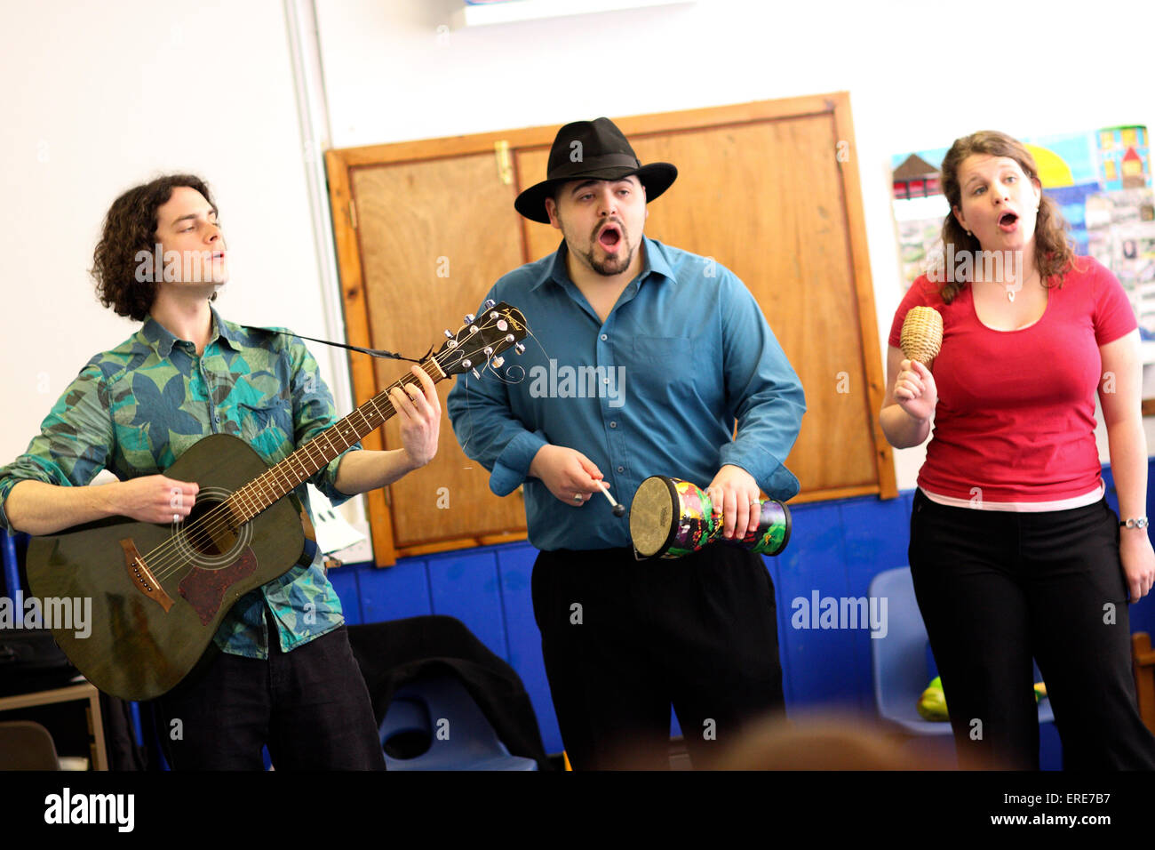 Music workshop in a school singing a song, learning through play and ...