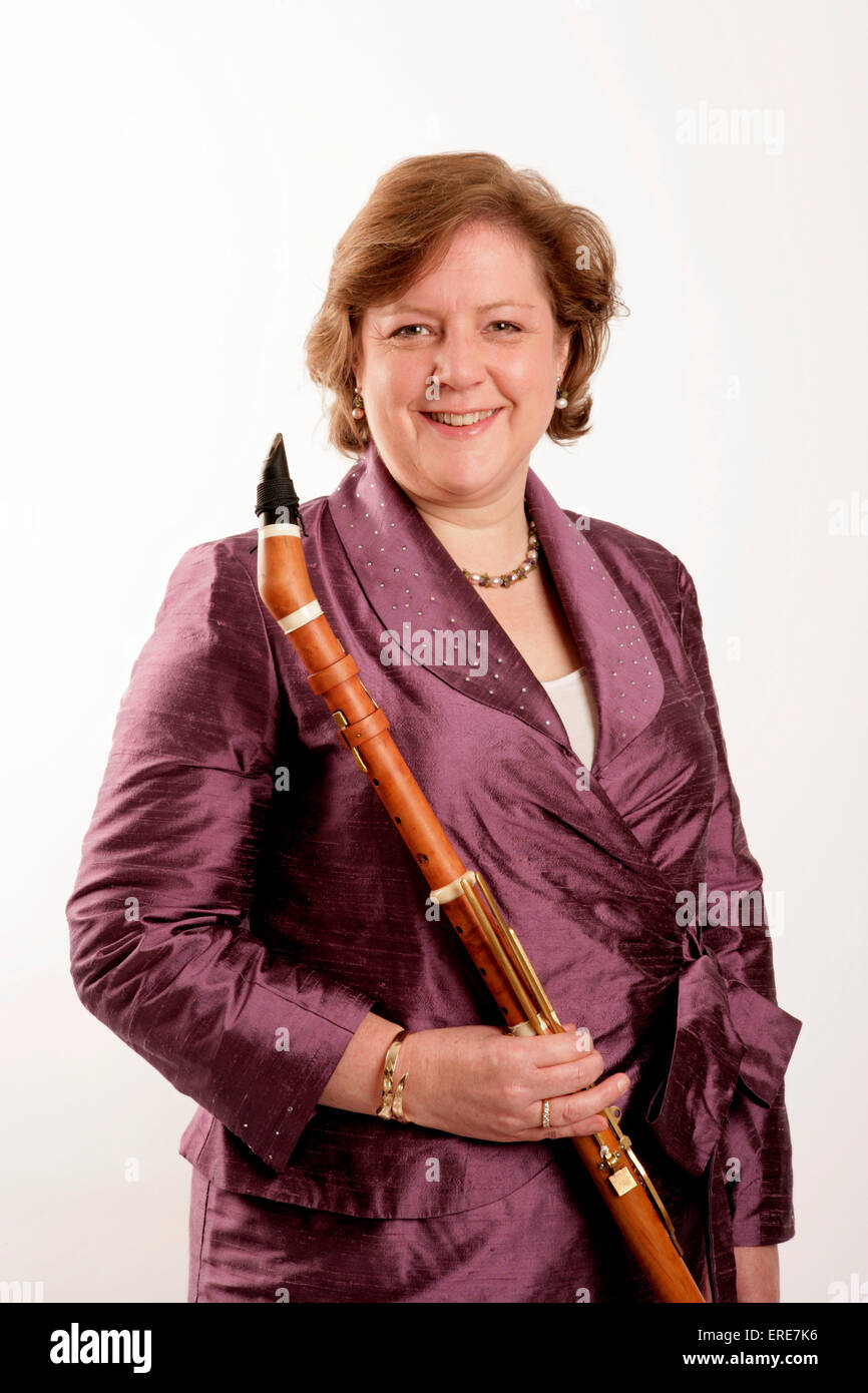Jane Booth holding a basset clarinet, Early music woodwind soloist ...