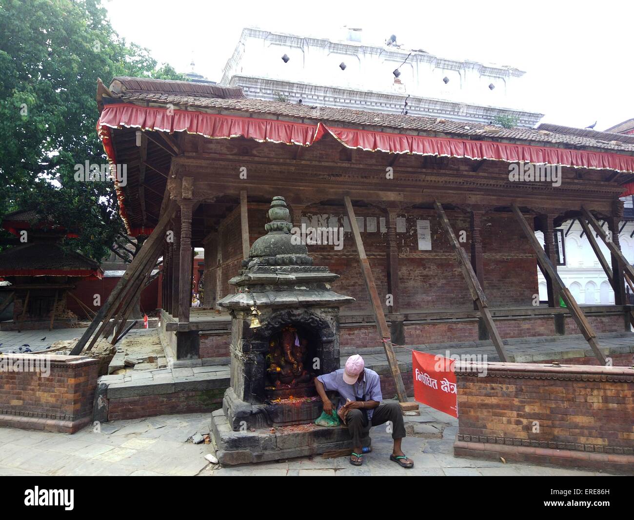 Kathmandu, Nepal. 2nd June, 2015. A Nepalese devotee offers morning ...