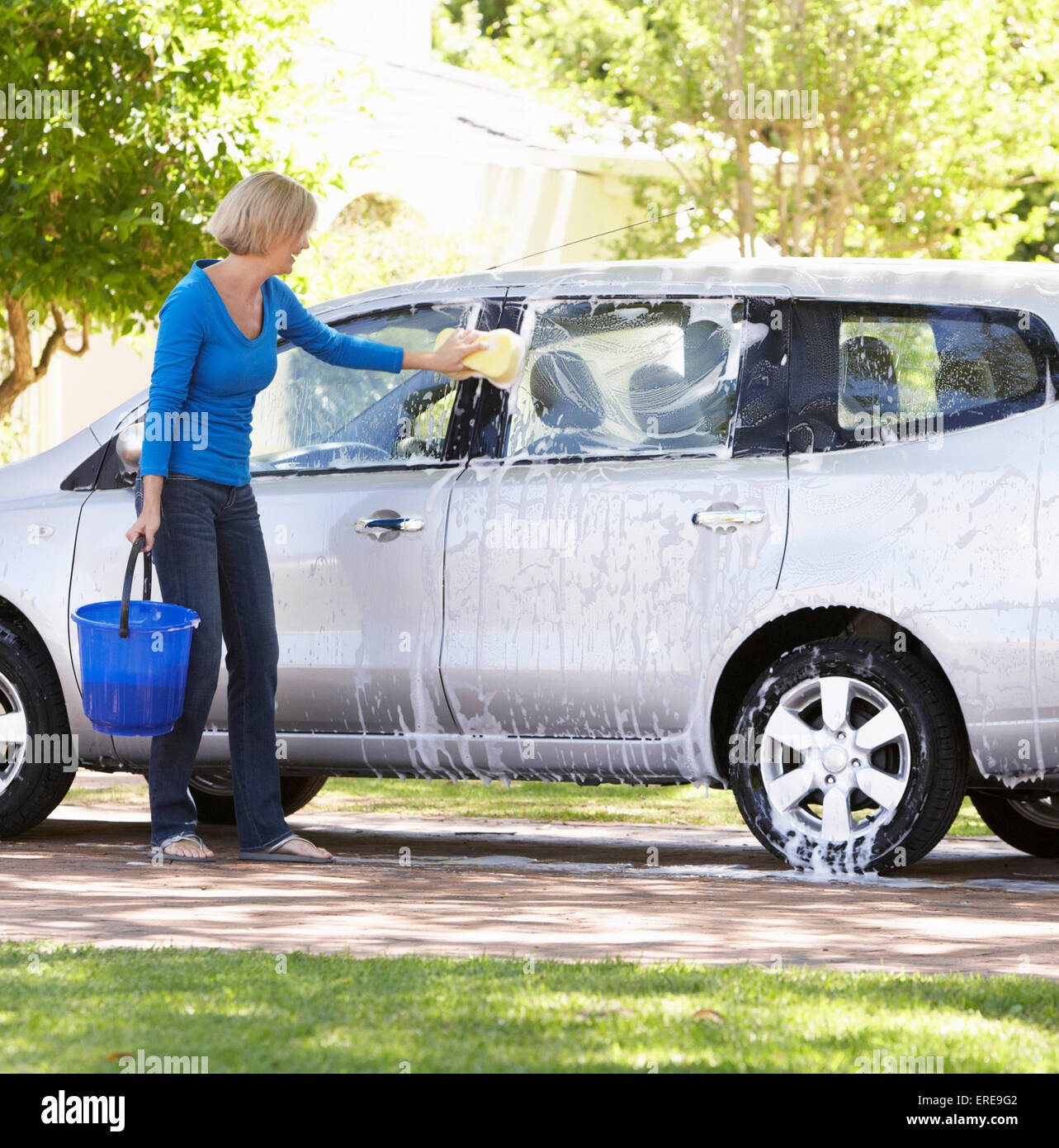 Woman Washing Car In Drive Stock Photo - Alamy