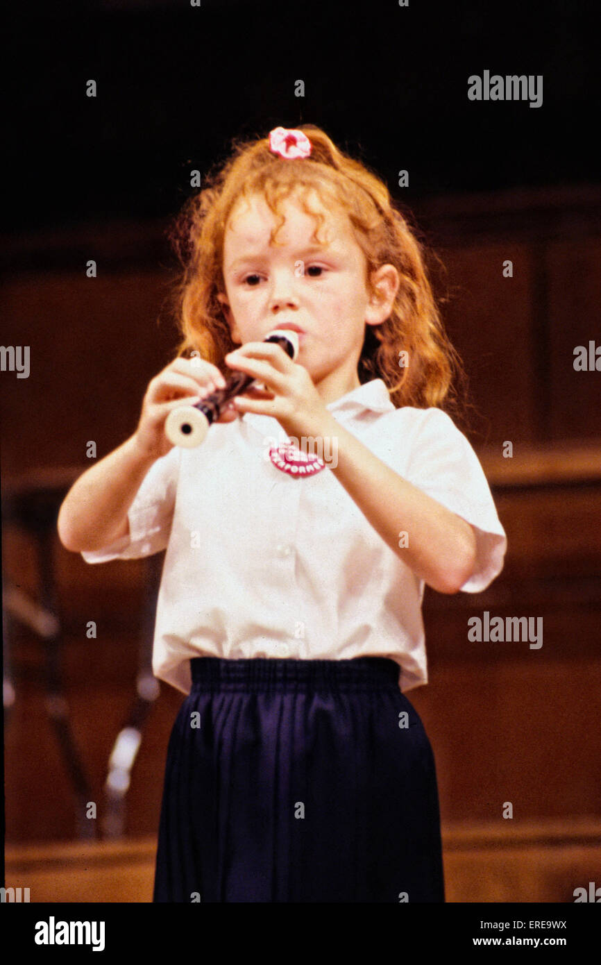Young girl playing recorder Stock Photo - Alamy