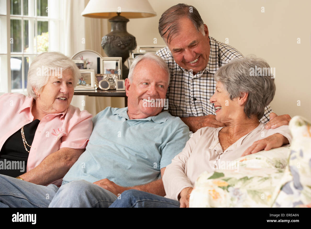 Group Of Retired Friends Sitting On Sofa At Home Together Stock Photo ...