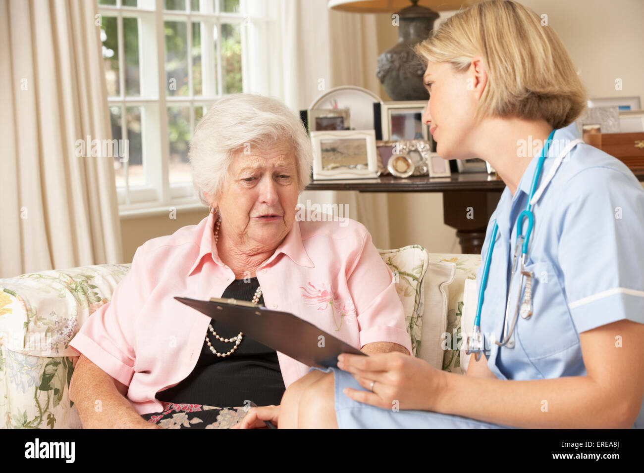 Retired Senior Woman Having Health Check With Nurse At Home Stock Photo ...