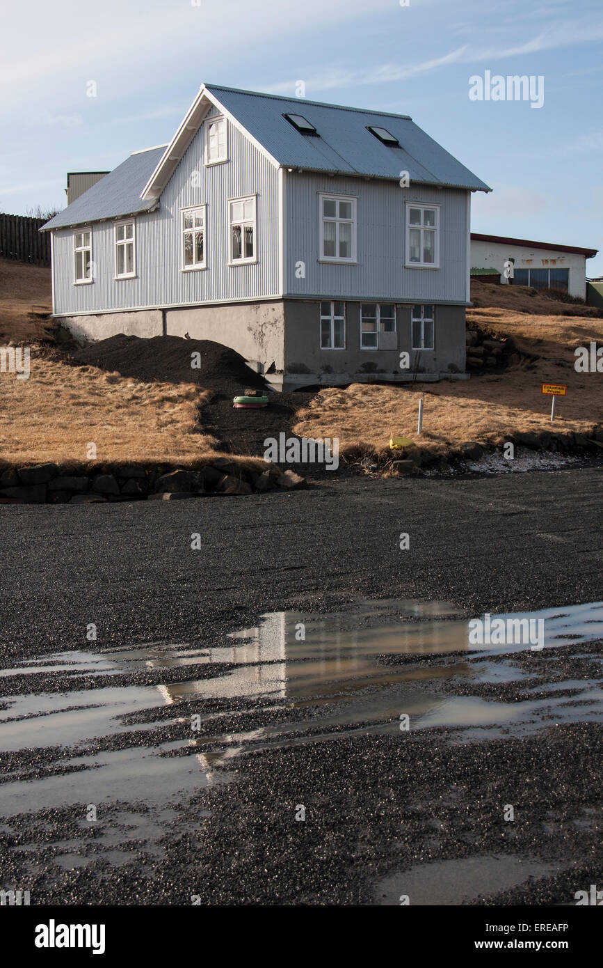 Domestic building built into a slope, with reflection Stock Photo - Alamy