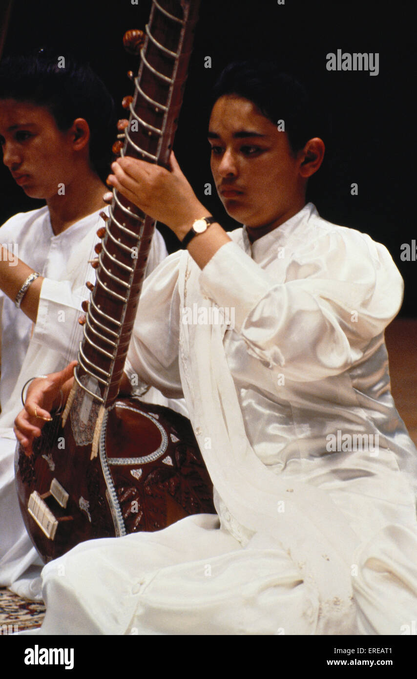 Young musician playing the sitar Stock Photo - Alamy
